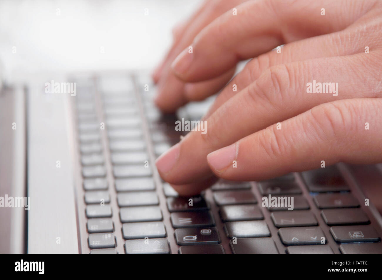 Hands typing on laptop computer Stock Photo - Alamy