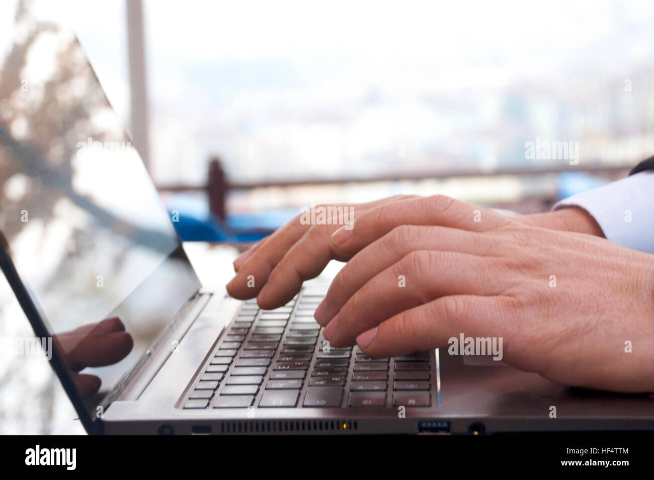 Hands typing on laptop computer Stock Photo - Alamy