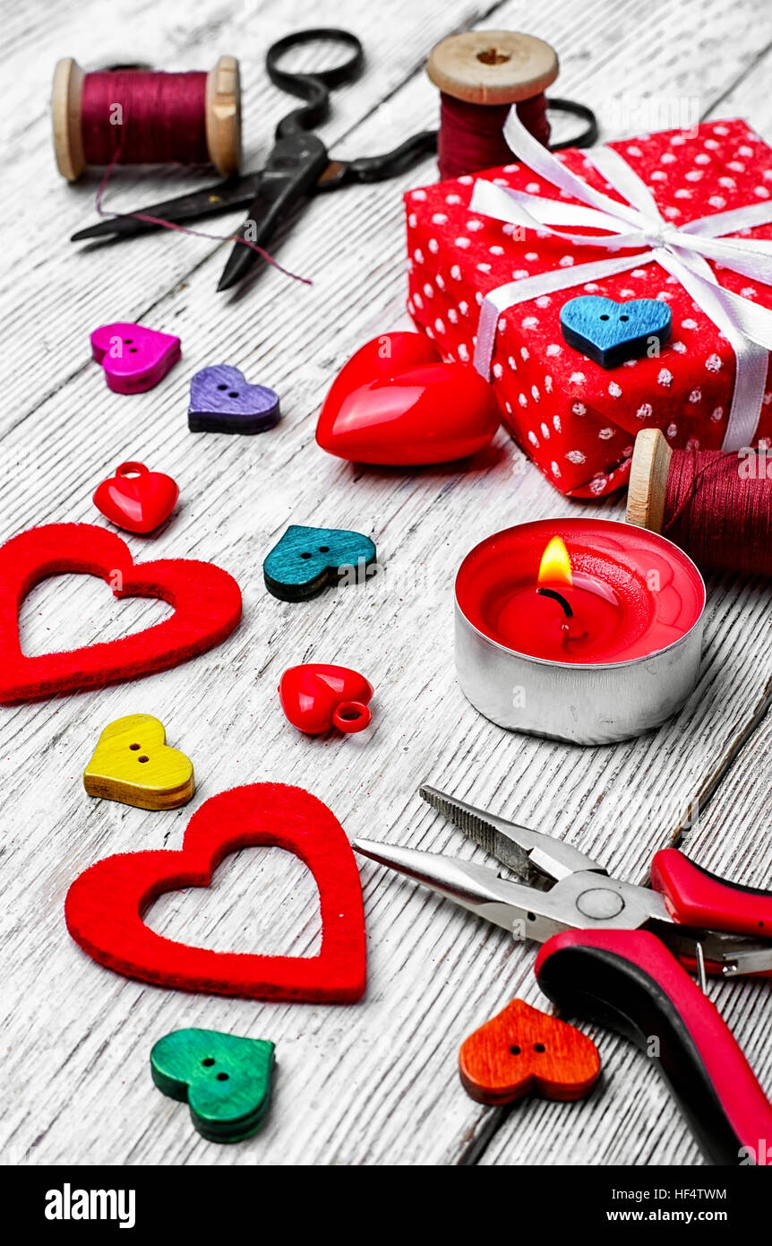 Packing holiday gifts for Valentine day.Thread,button and symbolic ...