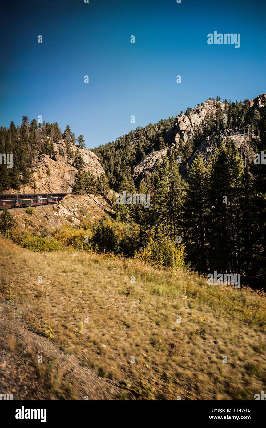 Railway train passing mountains hi-res stock photography and images - Alamy