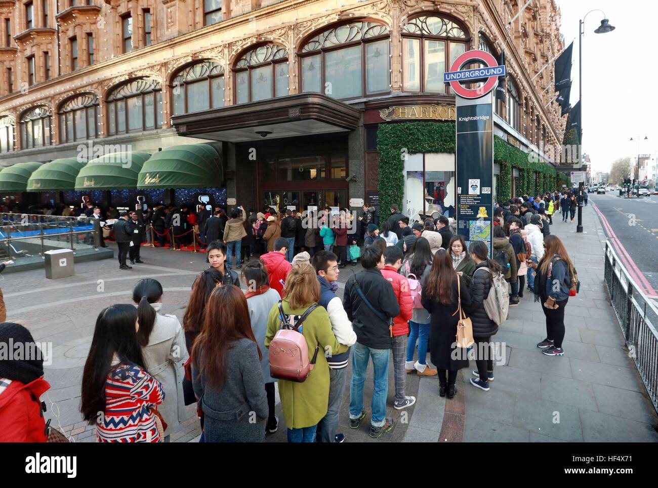 EDITORIAL USE ONLY Customers queue outside Harrods in Knightsbridge ...