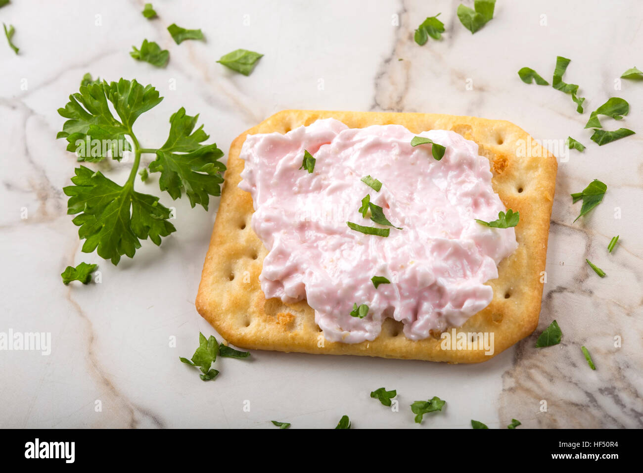 Thin crispy crackers with carp roe salad with herbs Stock Photo - Alamy