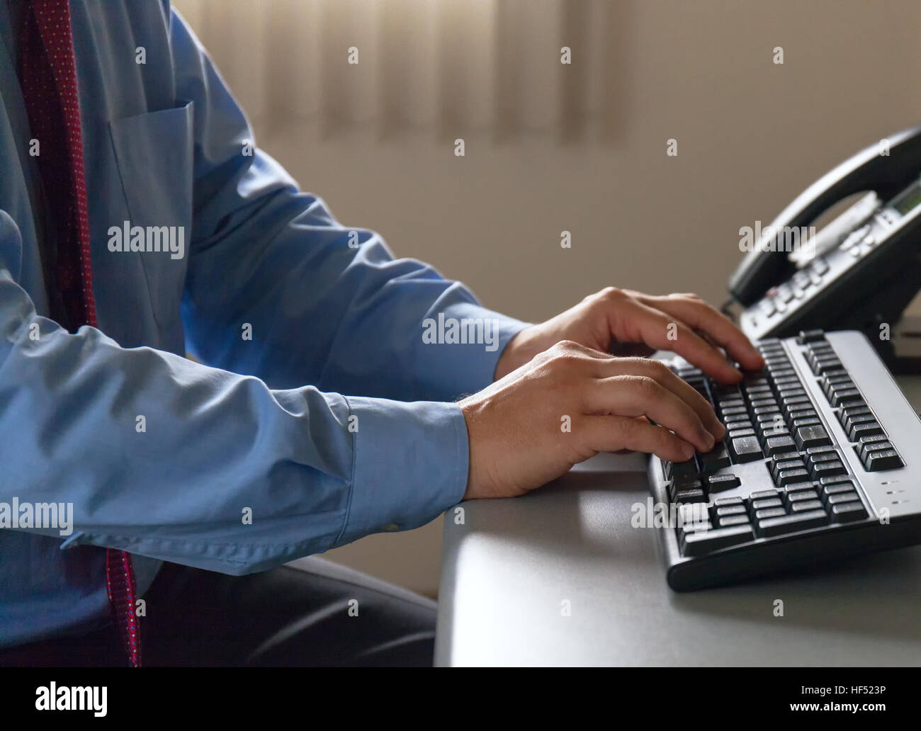 Worker typing hi-res stock photography and images - Alamy