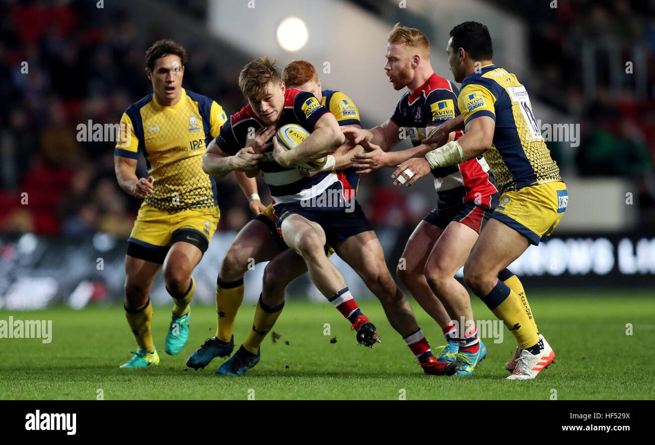 Bristol's Jason Woodward is tackled by Worcester Warriors' Connor Braid ...