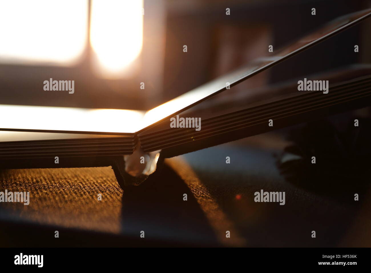 Photobook binding with layflat style at sunset Stock Photo - Alamy