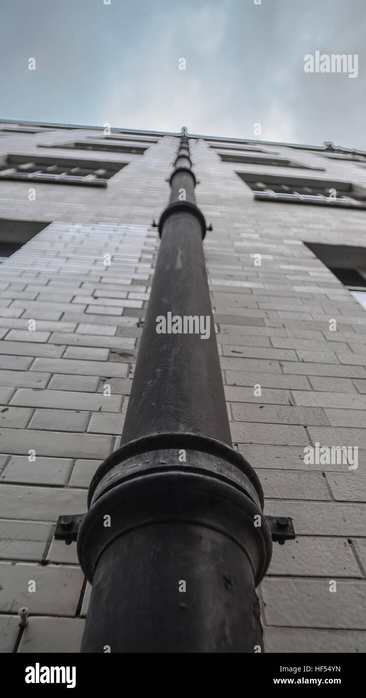 Low angle shot looking up of pipes and lamp posts Stock Photo - Alamy