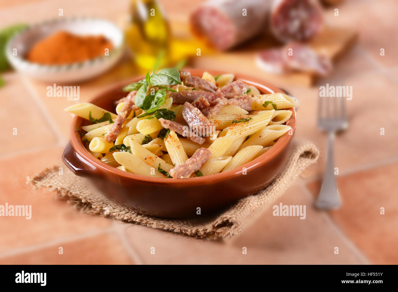 pasta with chilli and salami - Traditional Italian recipe Stock Photo ...