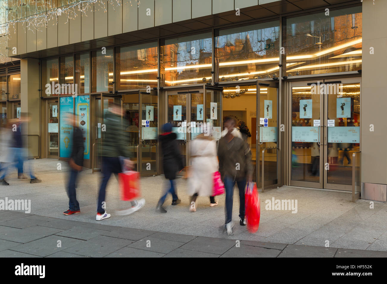People enter INTU Victoria Centre shopping mall with bags on Boxing Day ...