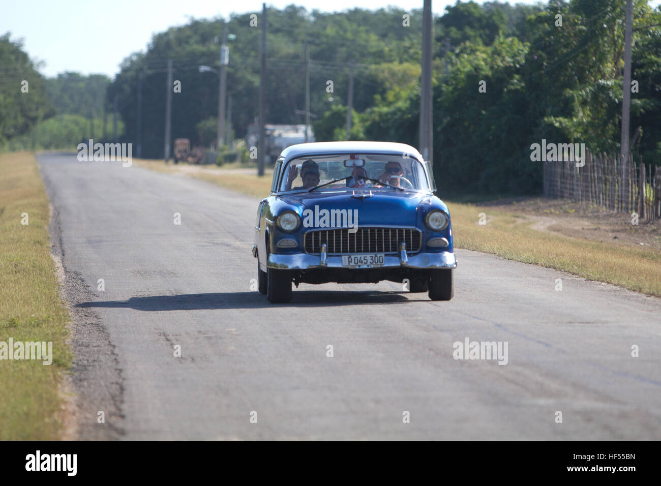 Old classic car cruising on a rural road in Cuba Stock Photo - Alamy