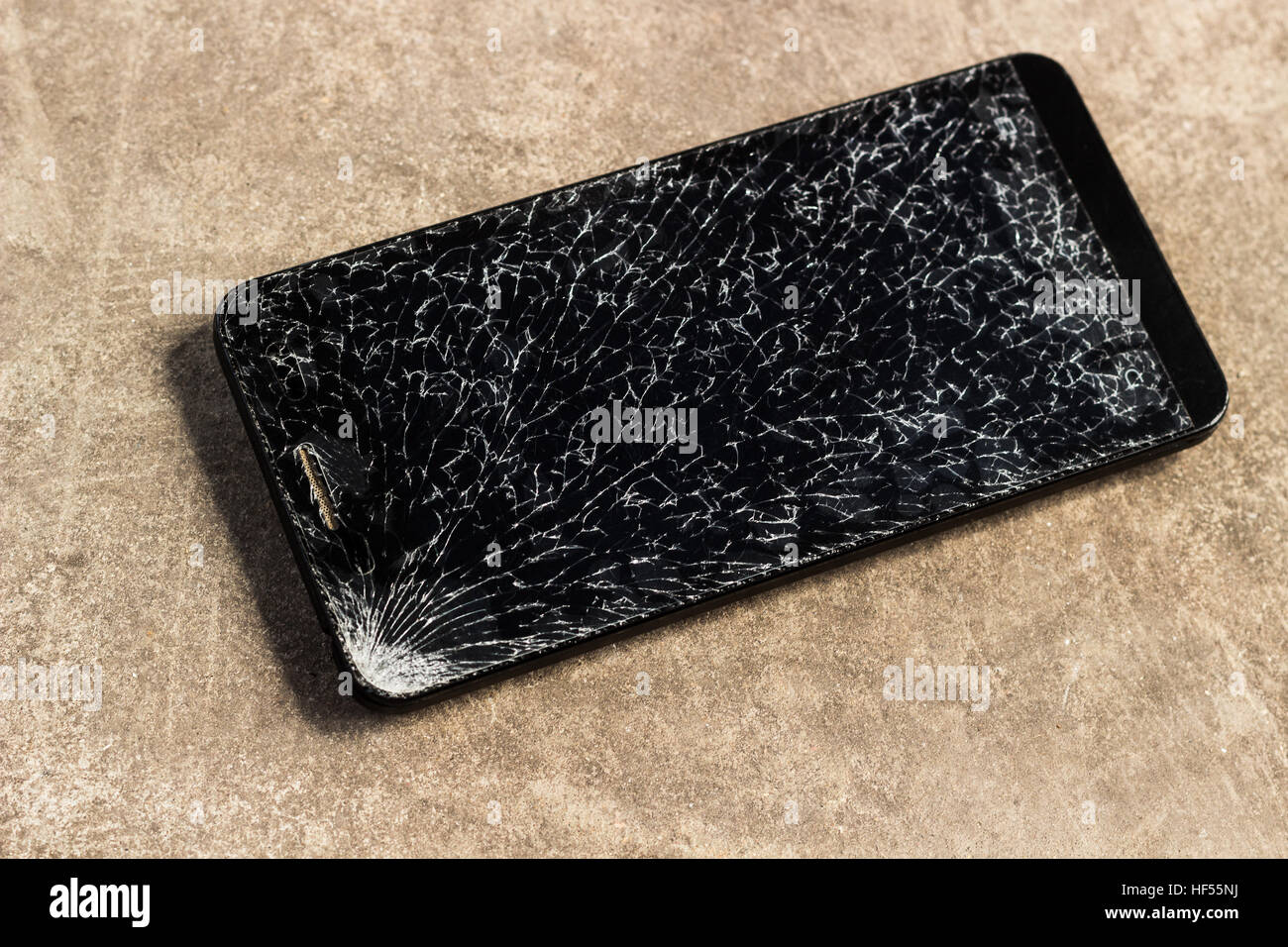 The broken screen cellphone on the floor Stock Photo - Alamy