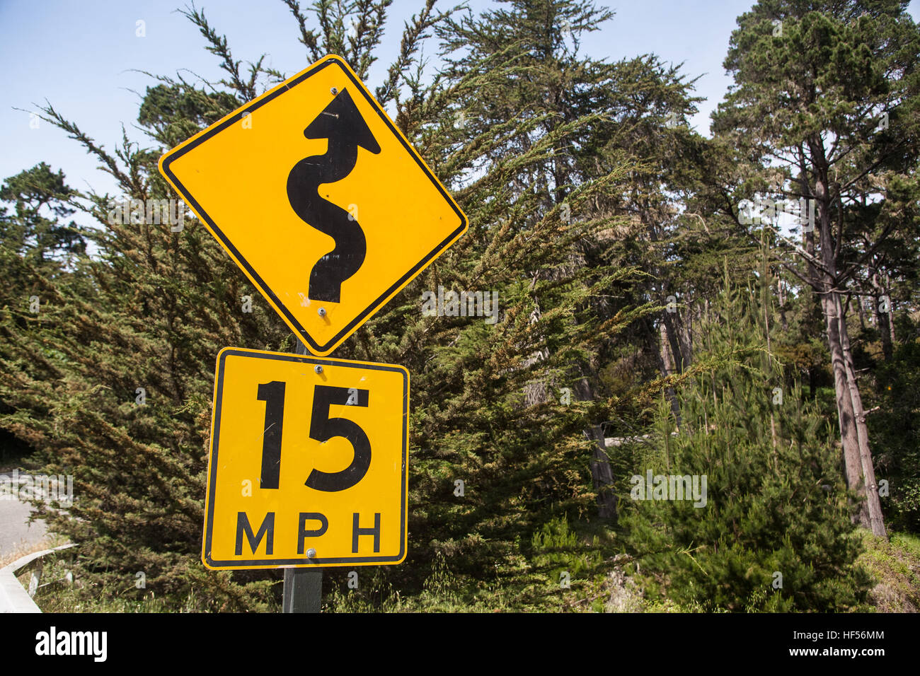car,cars,on,Winding,bend,bendy,low,speed,limit,sign,on,road,national ...