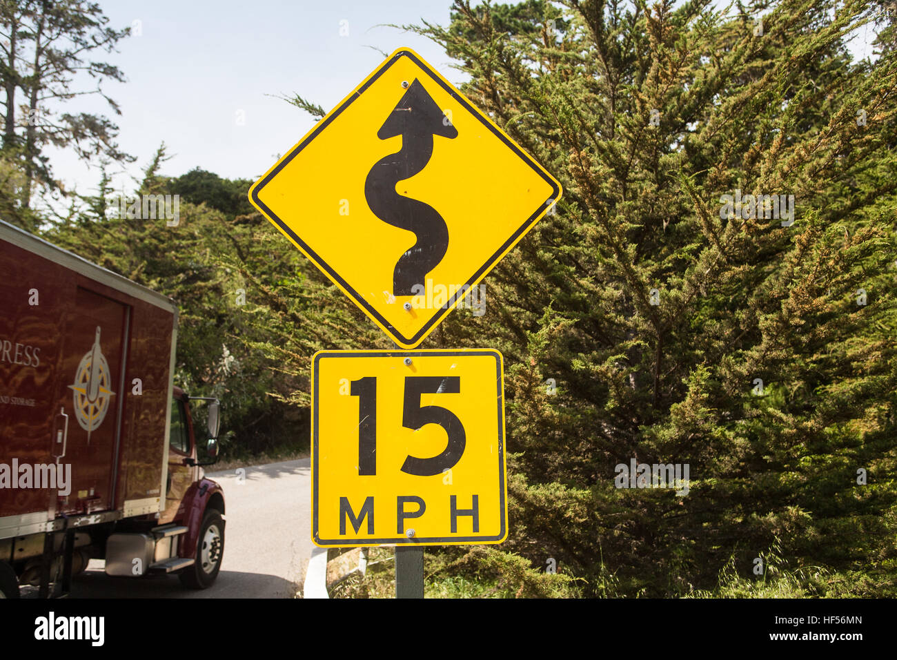 car,cars,on,Winding,bend,bendy,low,speed,limit,sign,on,road,national ...