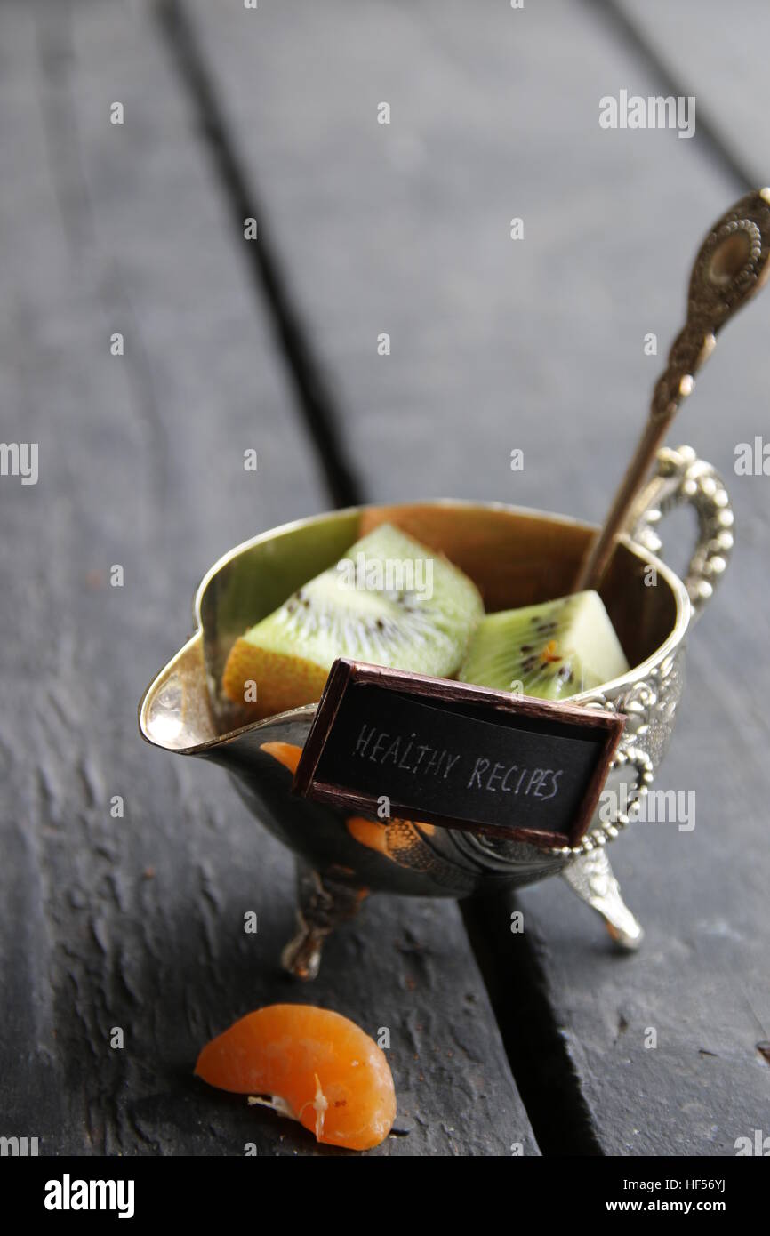 Healthy recipes tag and fruits on table. Food background Stock Photo ...