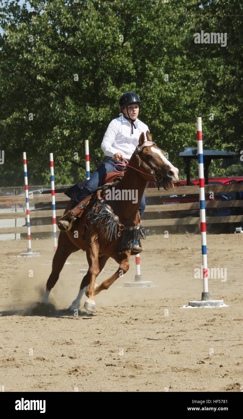 Teenage girl riding a horse in a pole race. Canfield Fair. Mahoning ...
