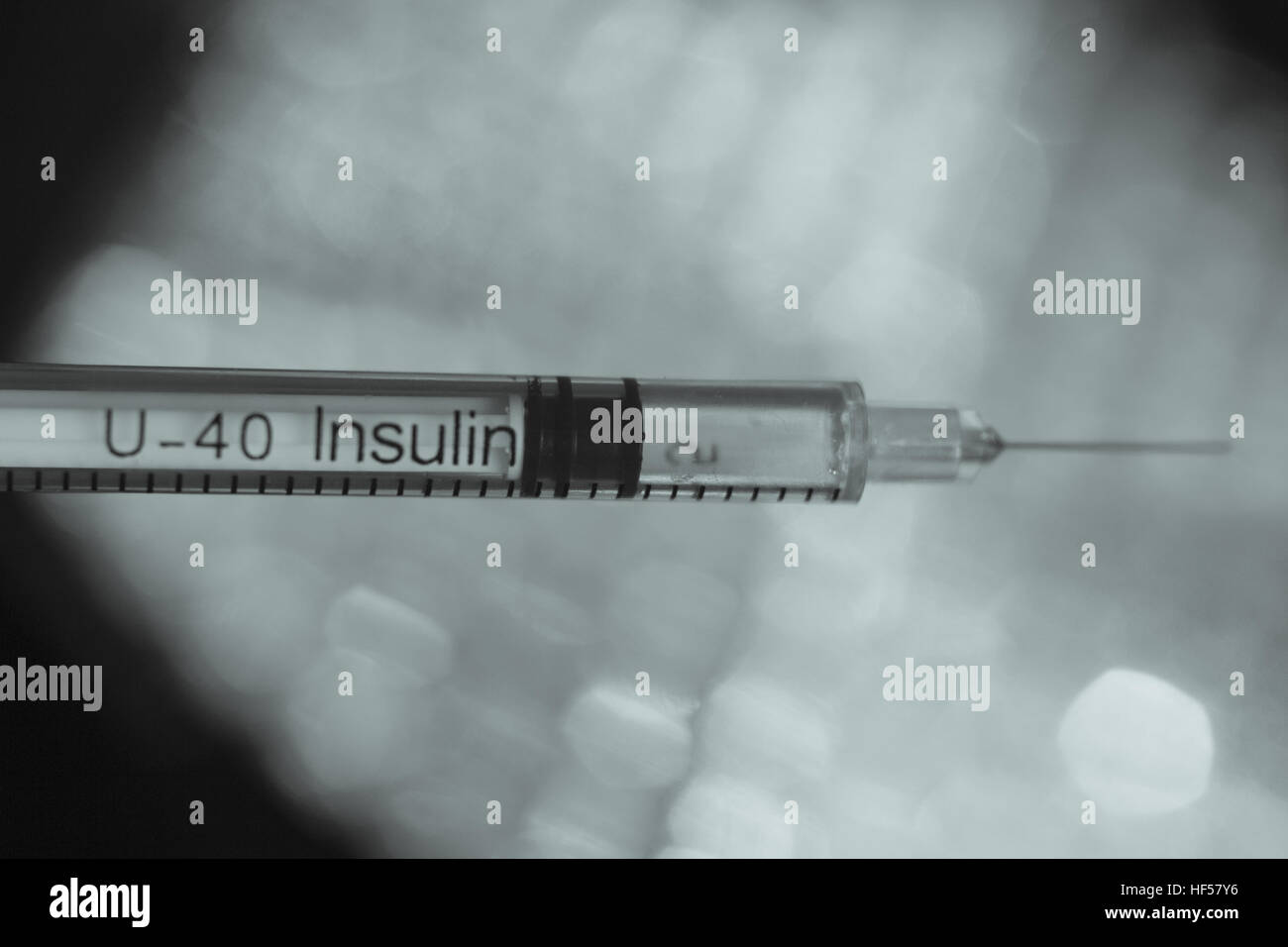 Insulin syringe on multicolored background out of focus Stock Photo - Alamy