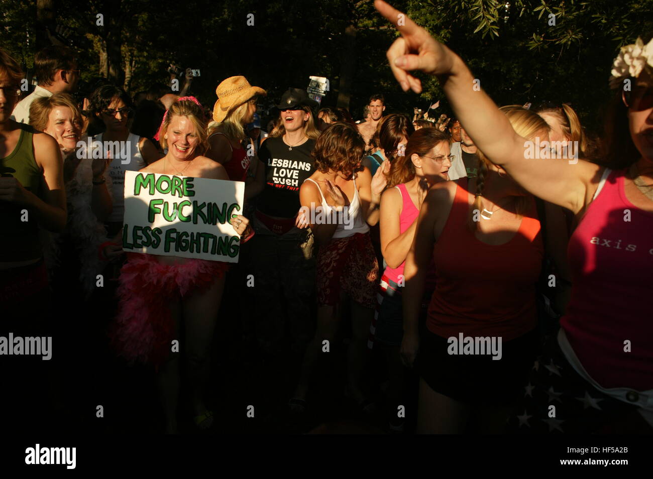Members of Axis of Eve protest against George W Bush, the war in Iraq ...