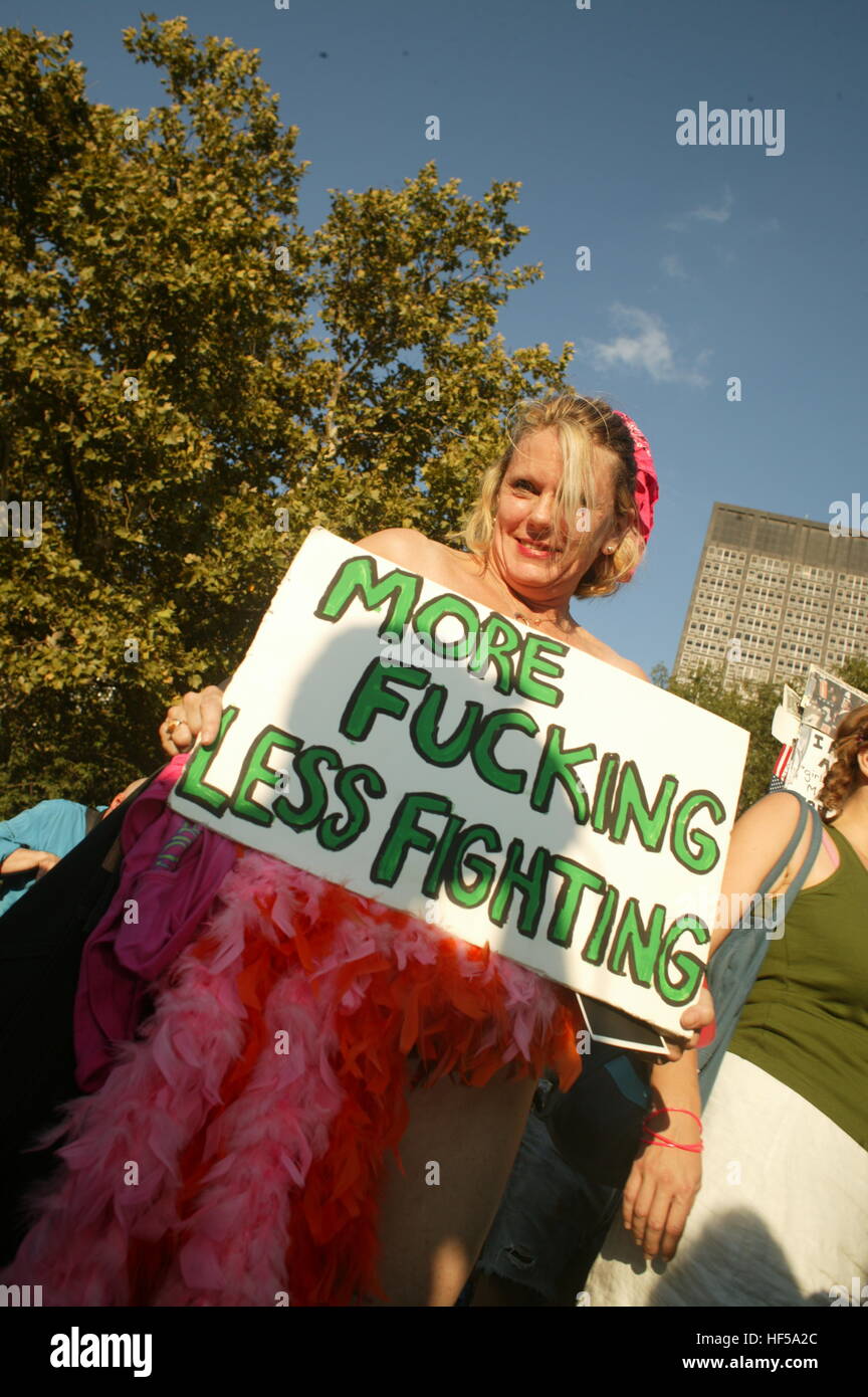 Members of Axis of Eve protest against George W Bush, the war in Iraq ...