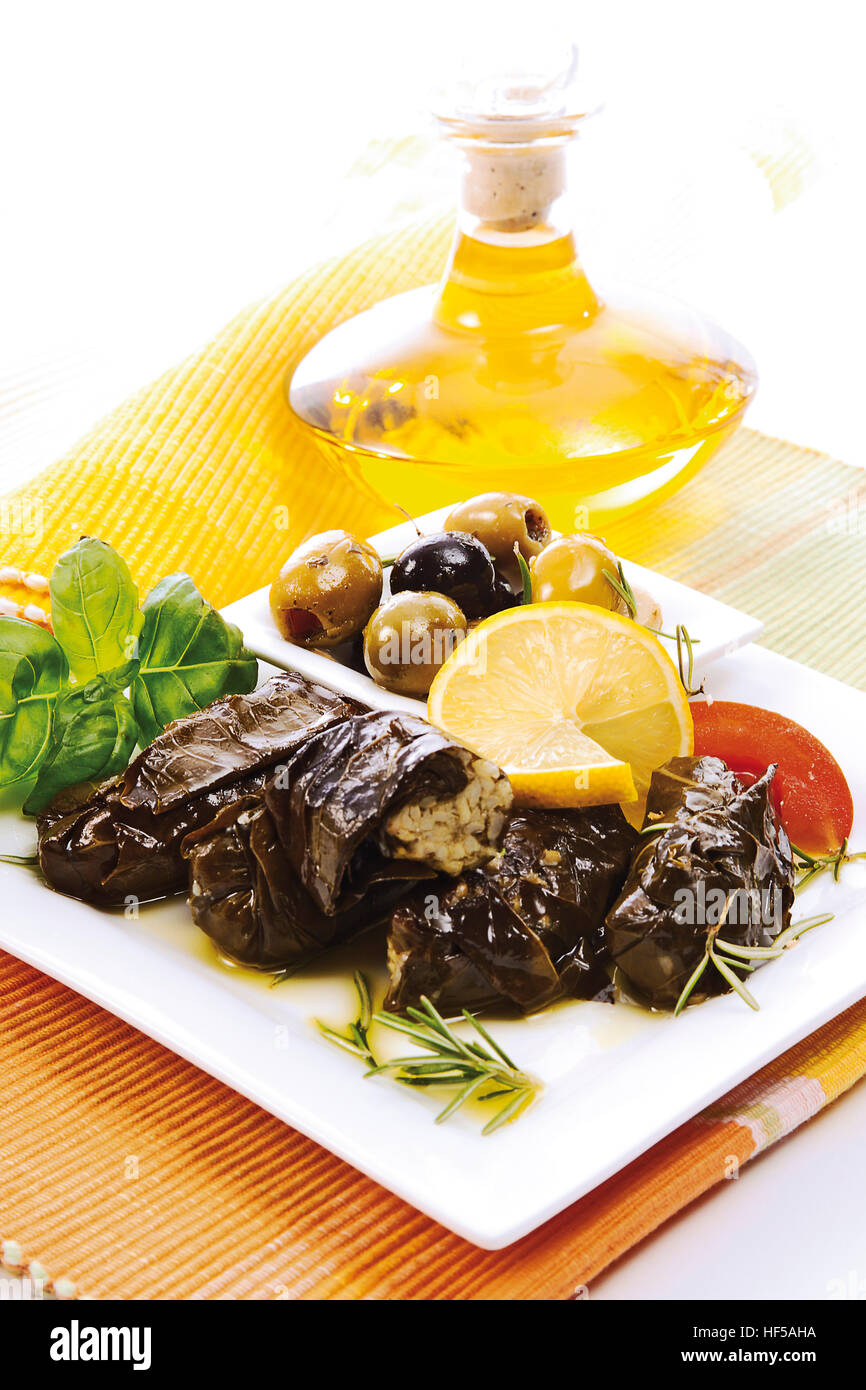 Greek specialty: dolmades (stuffed grape leaves) with rice, olives ...