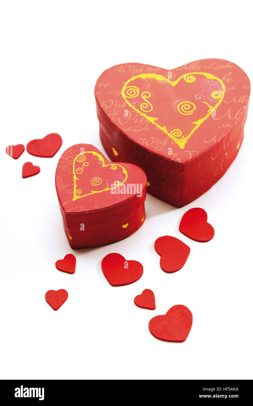 Heart-shaped gift boxes with little glass hearts Stock Photo - Alamy