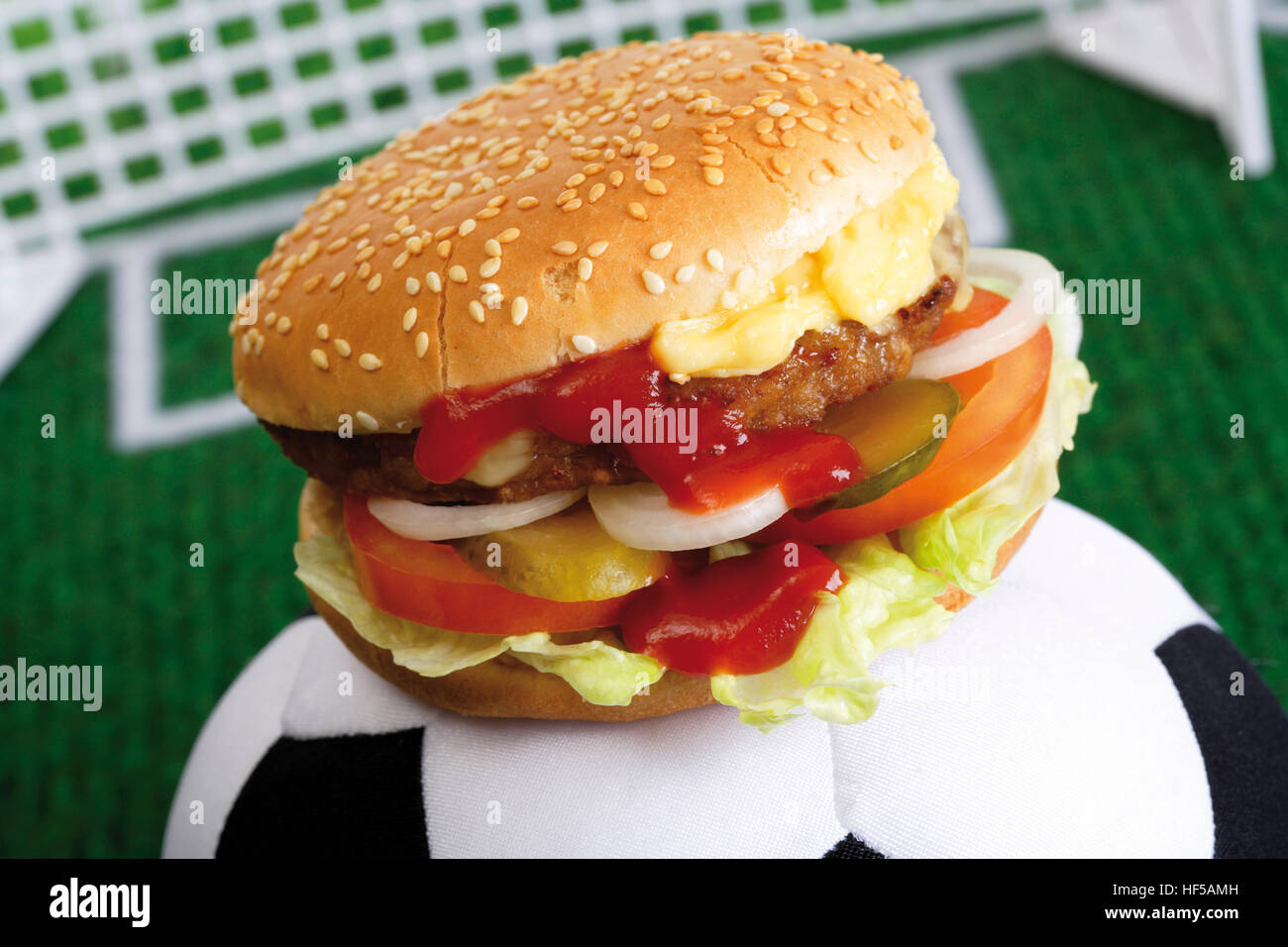 Football fast food - hamburger on a football Stock Photo - Alamy