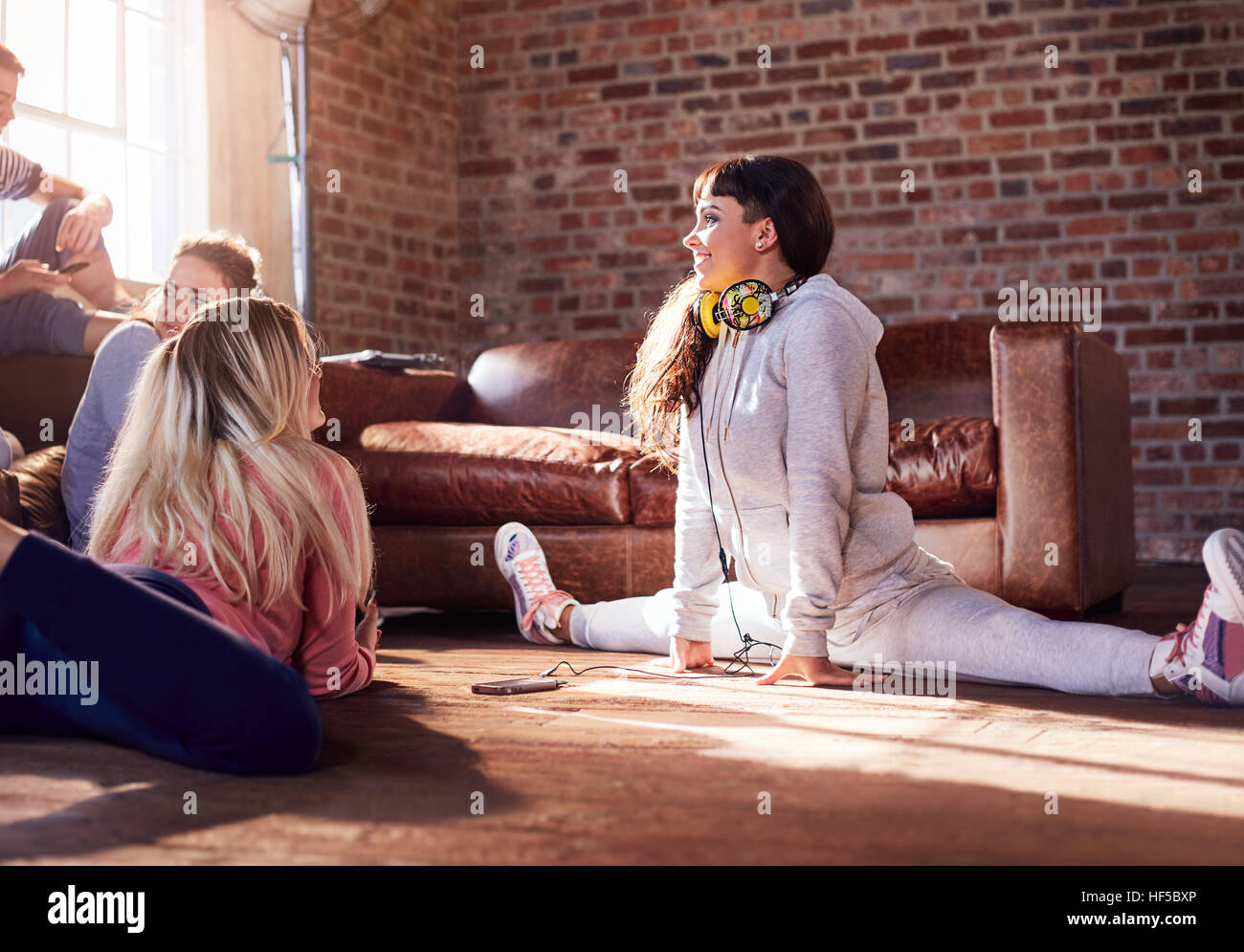 Young woman dancer stretching doing splits in studio Stock Photo - Alamy