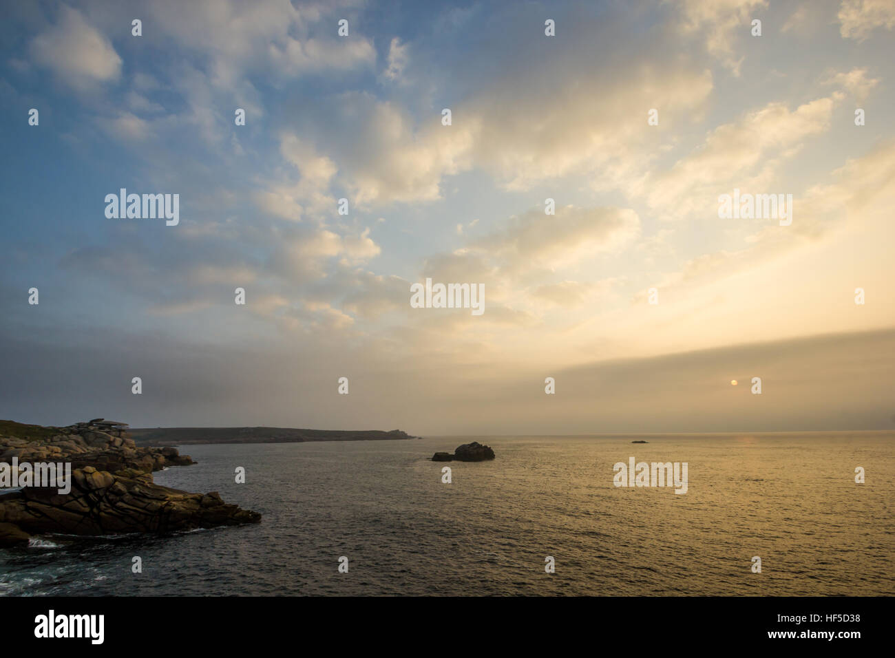 Pulpit rock with the sun rise through haze, St Mary's, Isles of Scilly ...