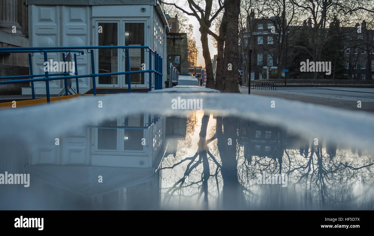Reflection in puddle of water Stock Photo - Alamy