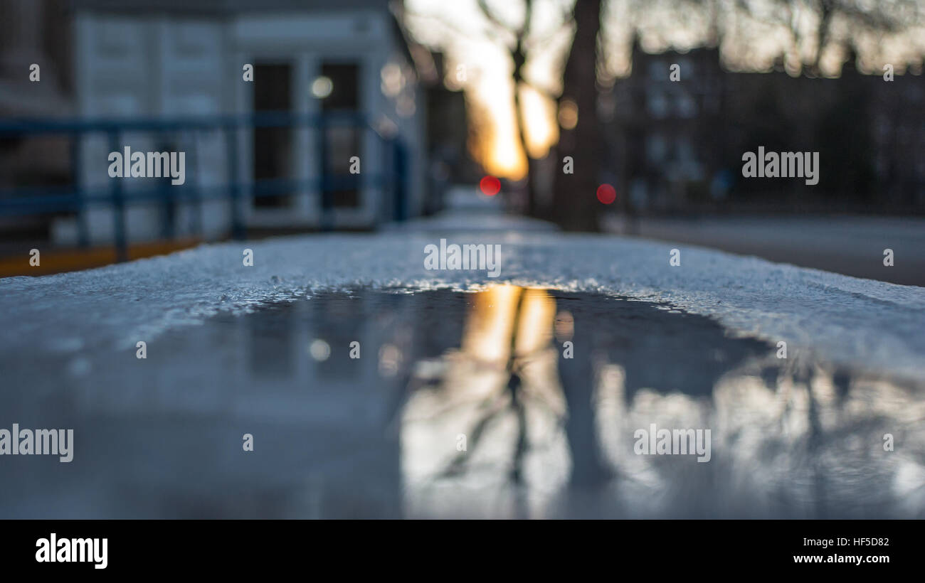 Reflection in puddle of water Stock Photo - Alamy