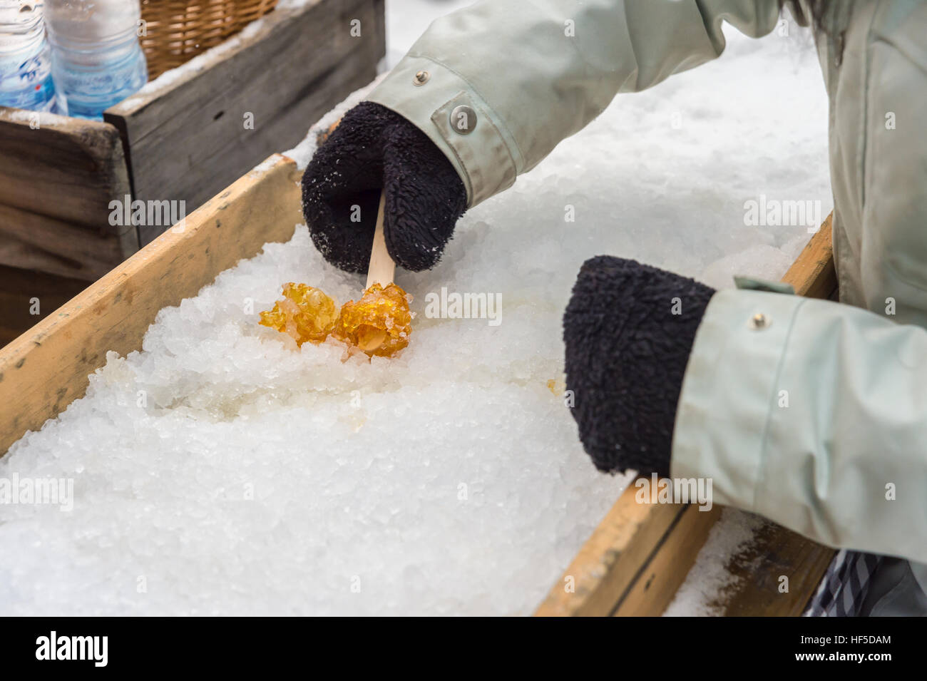 Maple taffy on snow in Montreal, Quebec, Canada Stock Photo - Alamy