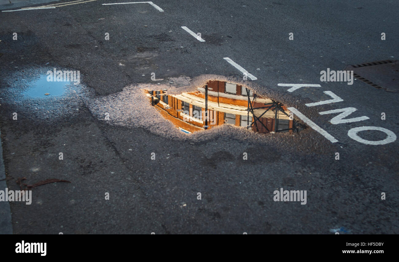 Reflection in puddle of water Stock Photo - Alamy