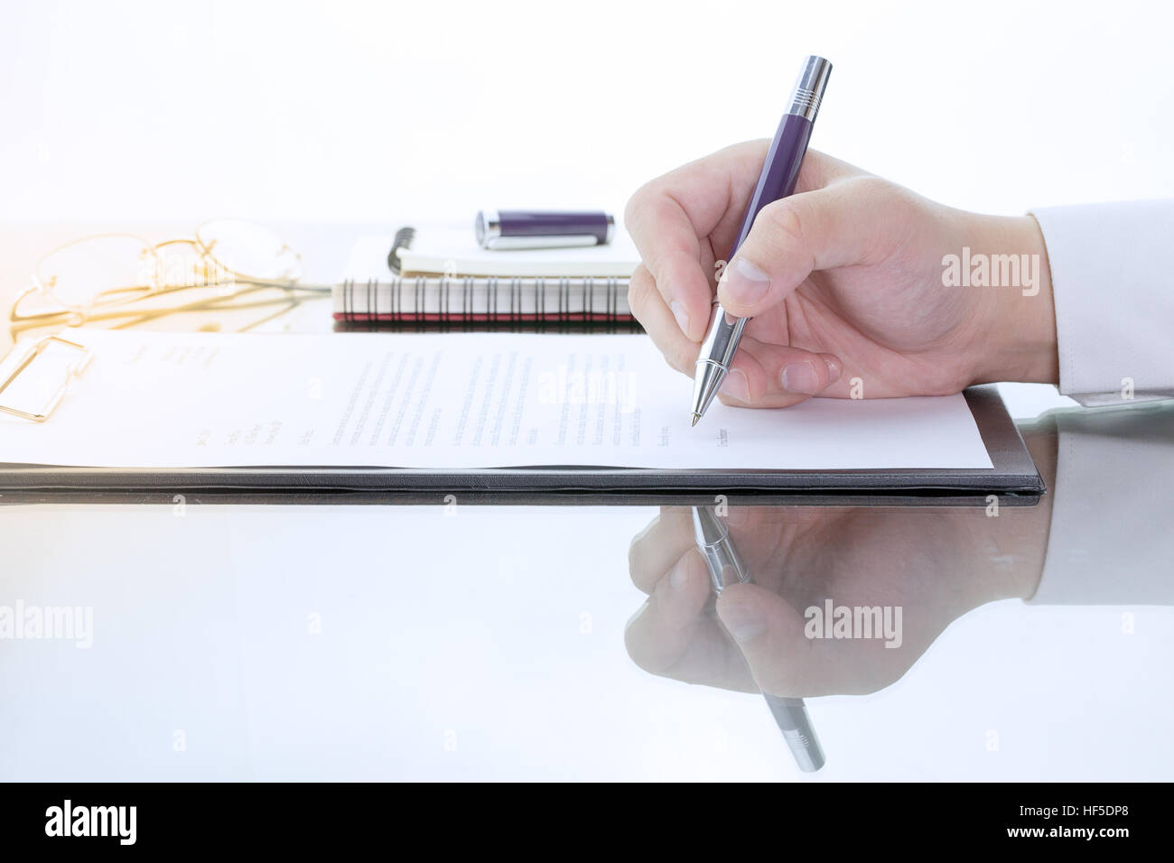 Hand with pen over application form, Businessman signing a contract ...