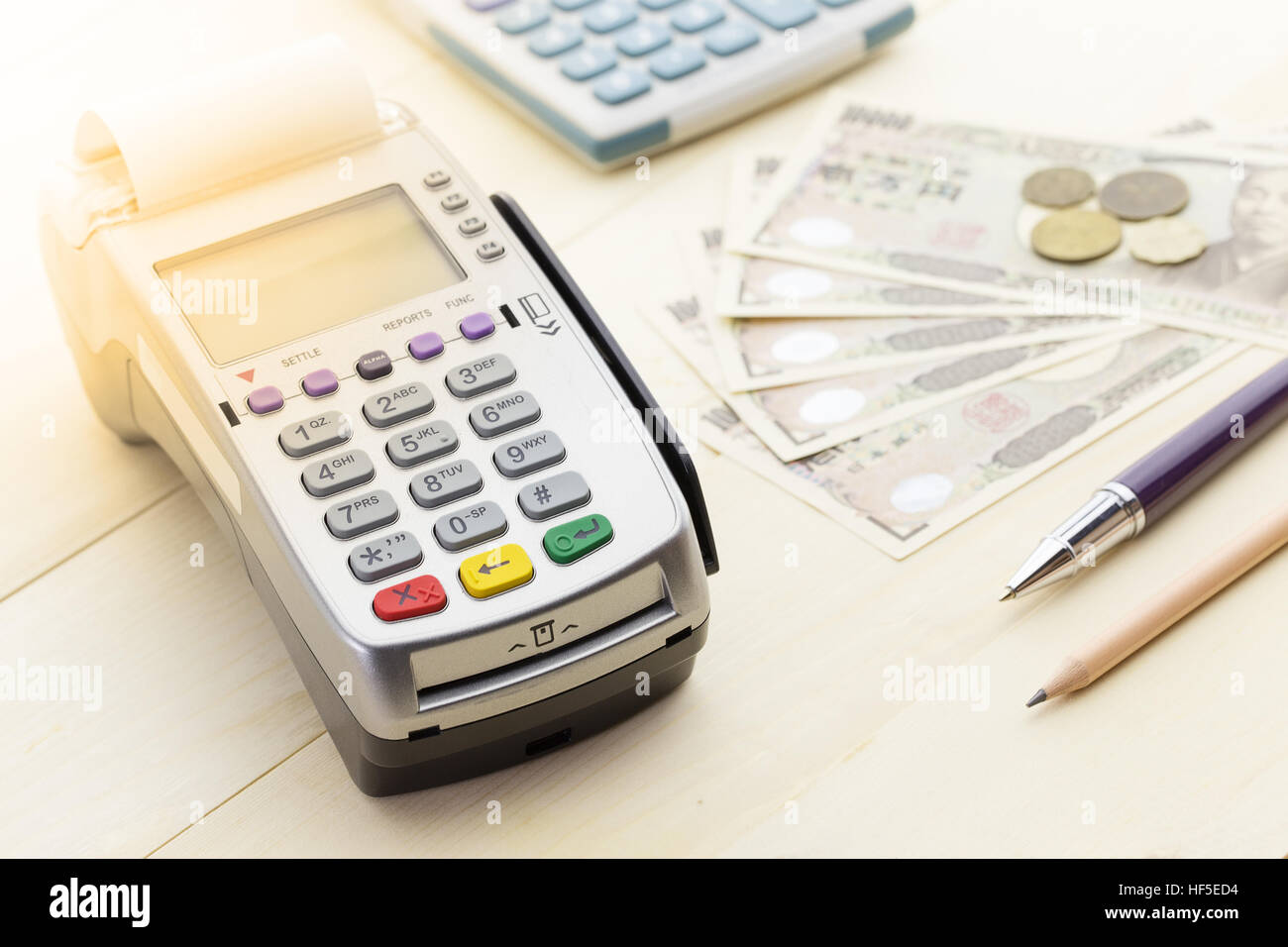 Credit Card Terminal or EDC on cashier wooden table in the store with ...