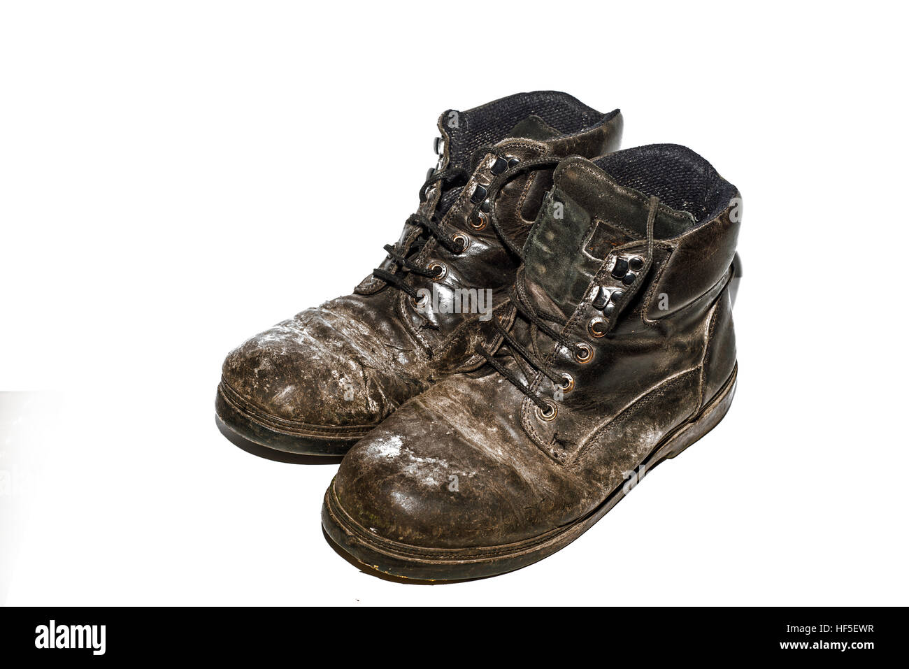 very old pair of black shoes on white background Stock Photo - Alamy