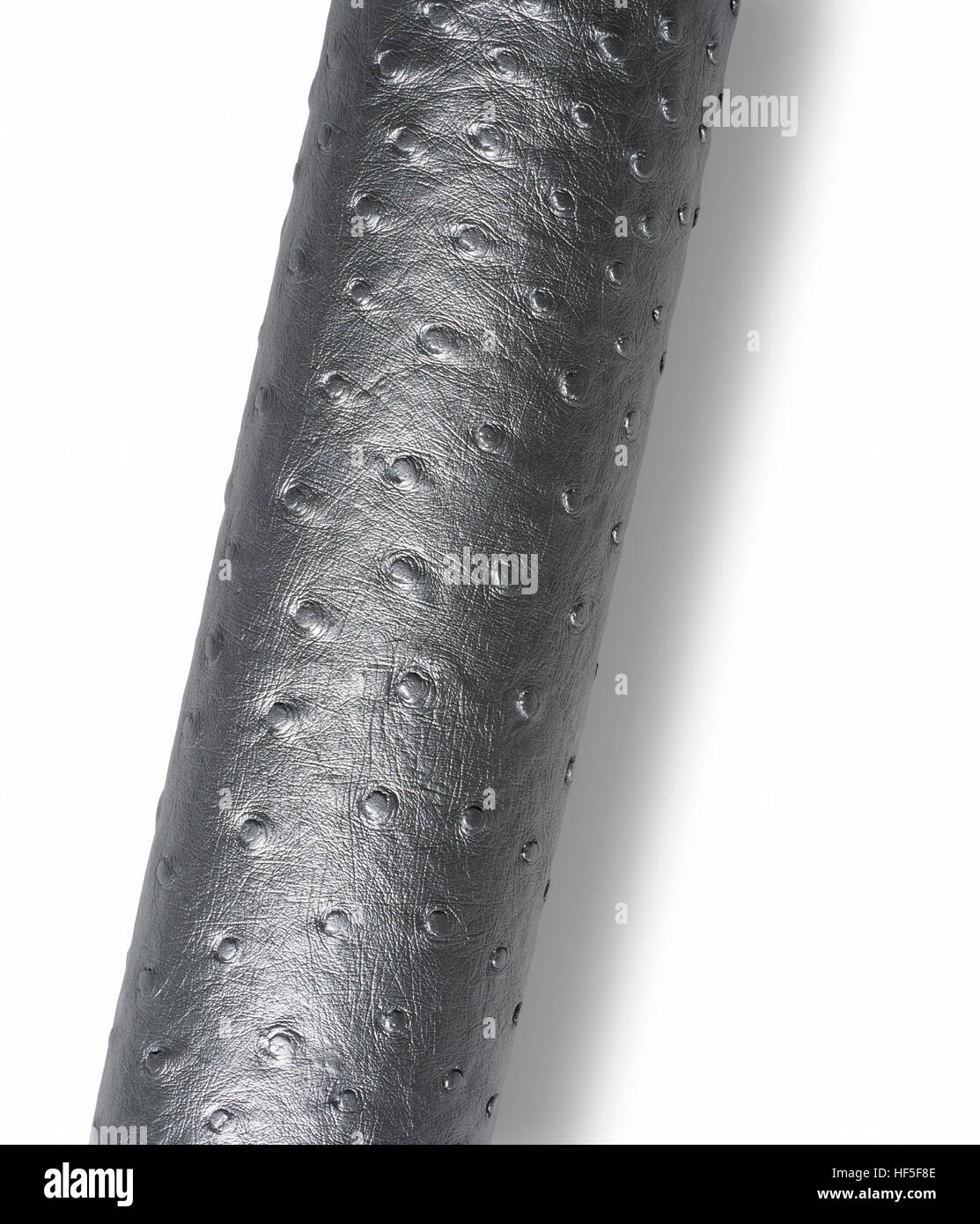 rolled silver ostrich leather textured surface isolated on white with ...