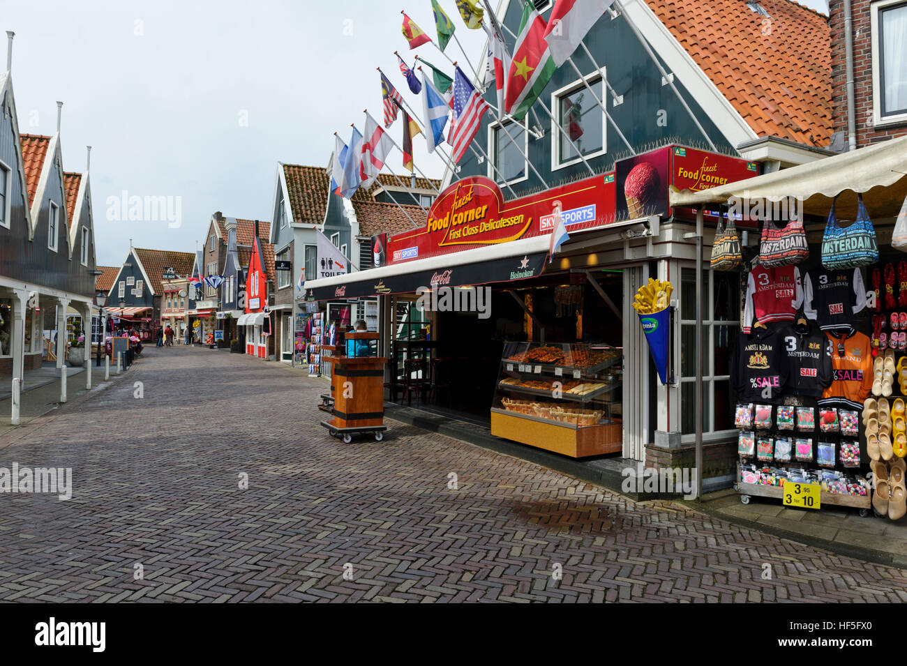 The main street leading to the harbour in the fishing village of ...