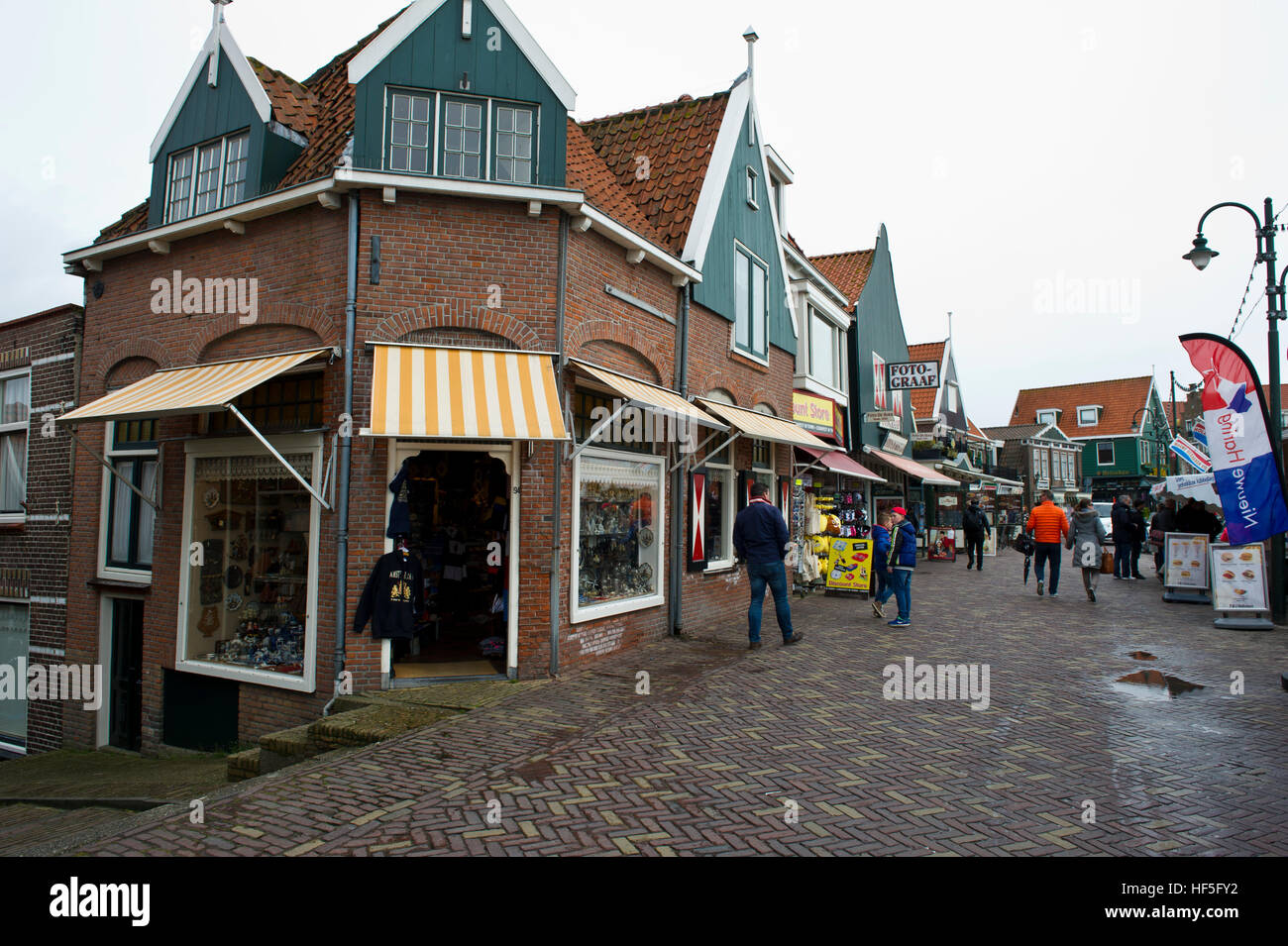 The main street leading to the harbour in the fishing village of ...