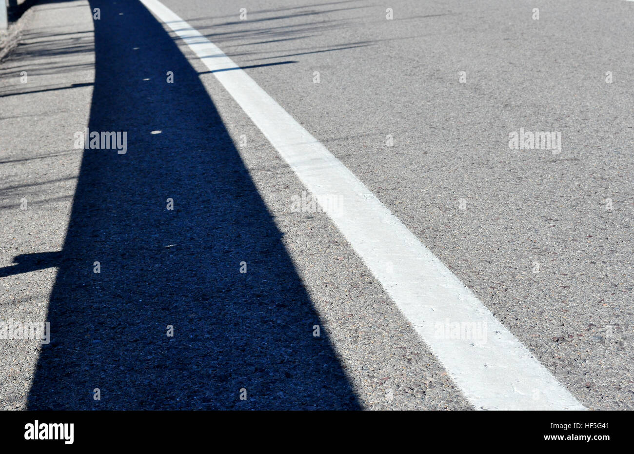 Road, parapet and asphalt with white line Stock Photo - Alamy