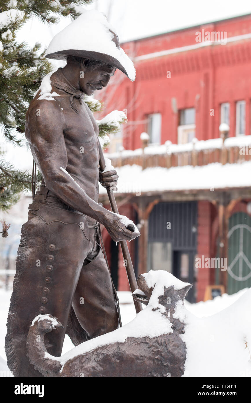 "All Around Cowboy" bronze sculpture, by Austin Barton, on a winter day ...