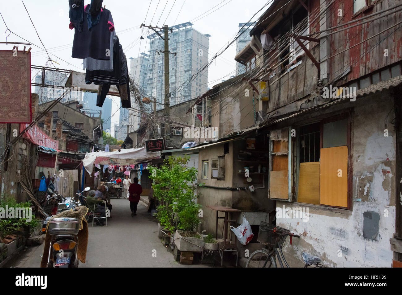 Old residential houses with modern high rise behind, Shanghai, China ...
