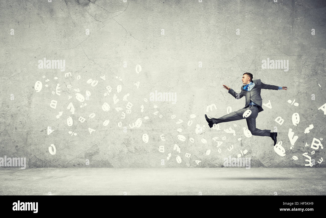 Businessman jumping high Stock Photo - Alamy