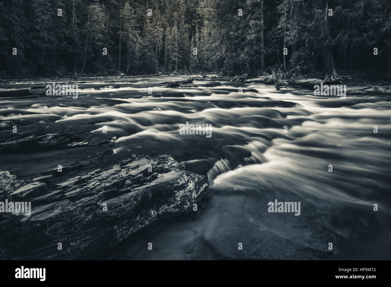 Black and white flowing river Stock Photo - Alamy