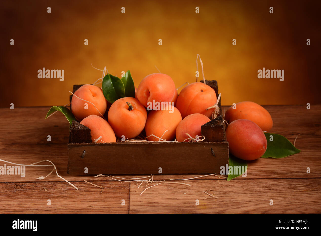 apricots in a wooden box Stock Photo - Alamy