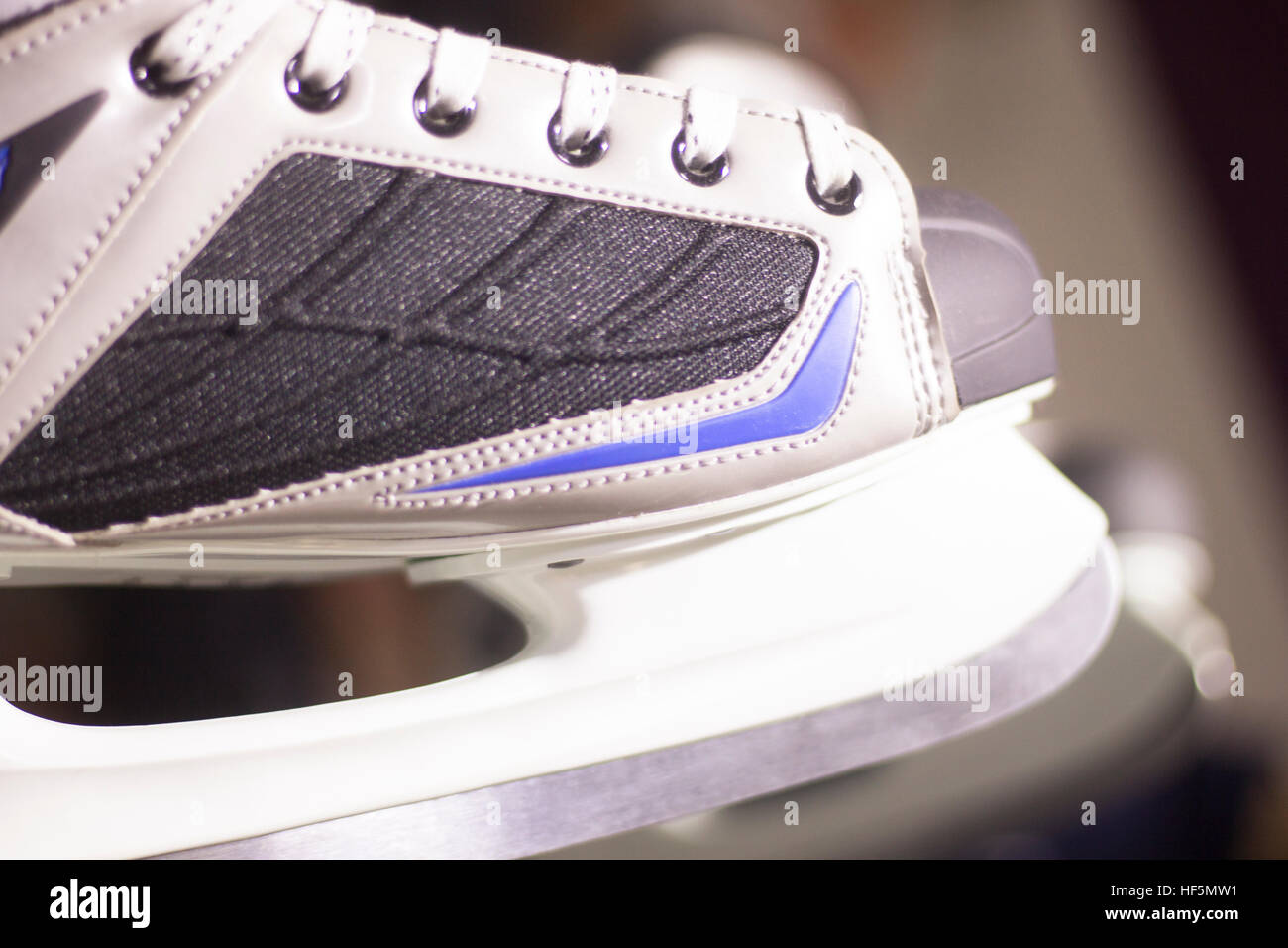 Ice skates in skate store shop window on display on sale for skating on ...