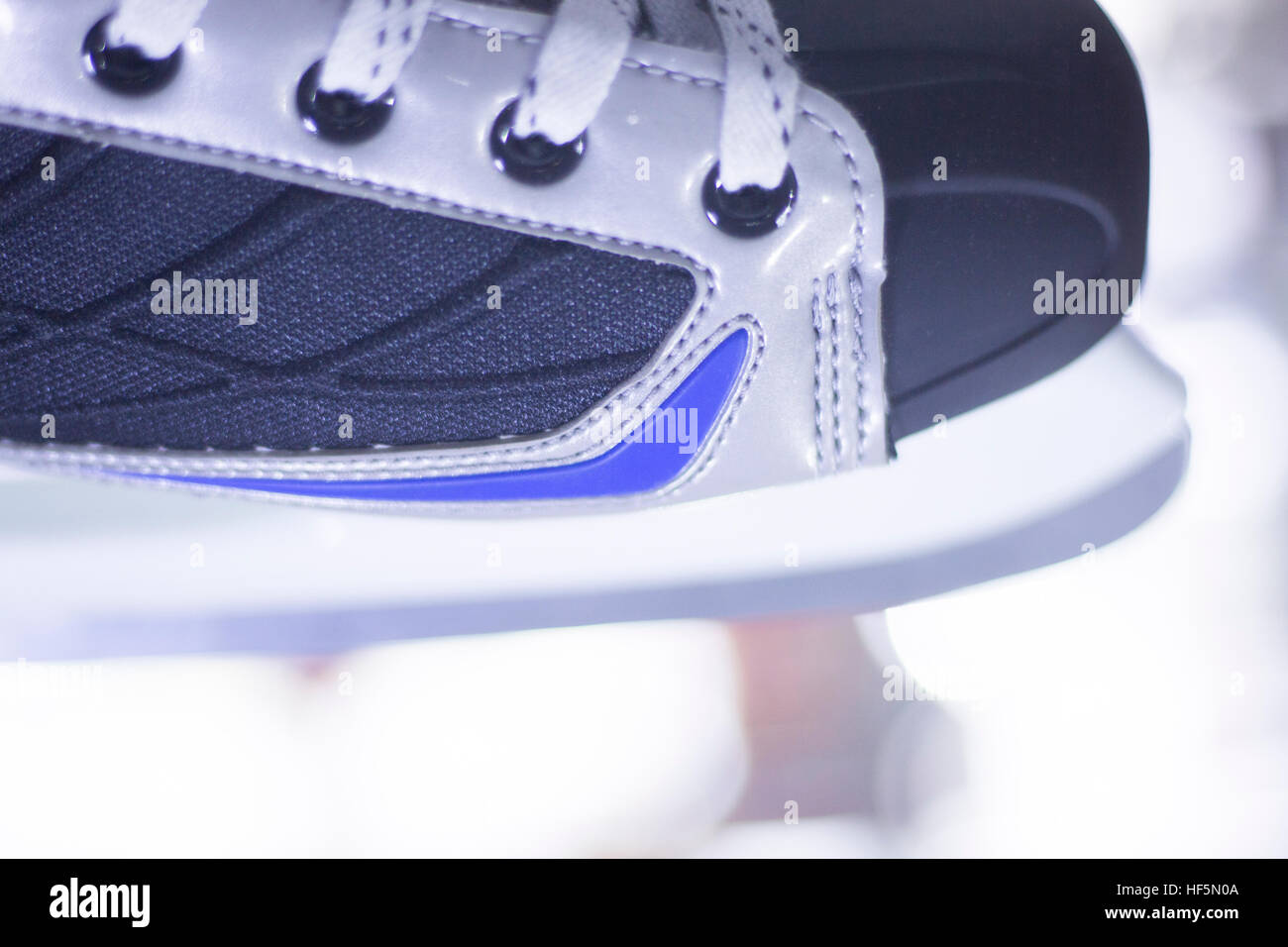 Ice skates in skate store shop window on display on sale for skating on ...