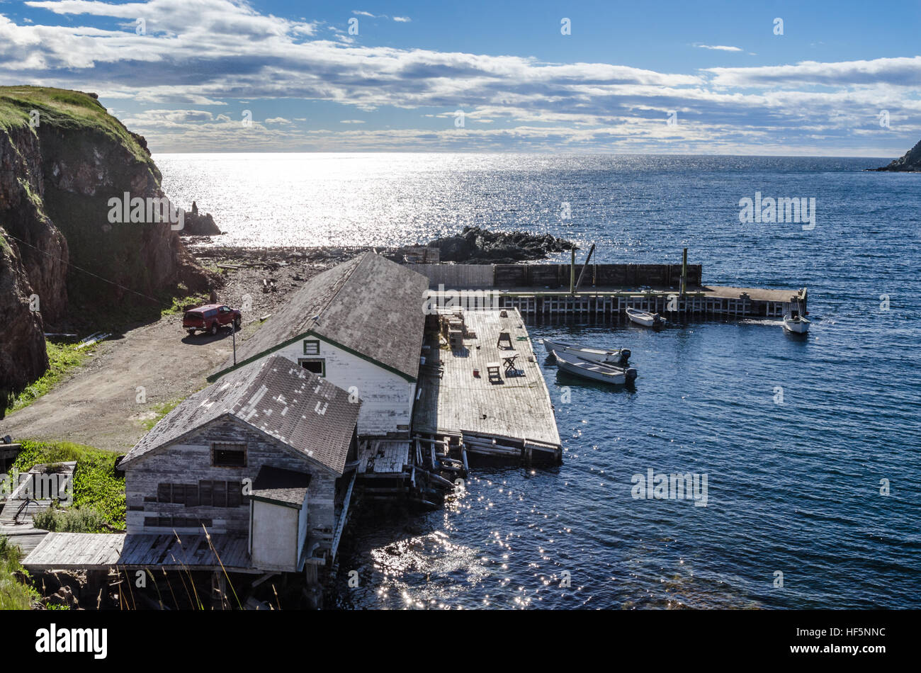 Pickup truck and boats at a cliff side dock in Twillingate ...