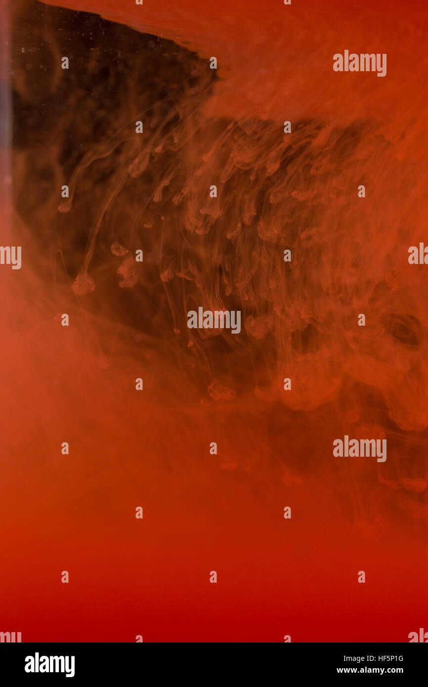 Red paint drops in the water Stock Photo - Alamy
