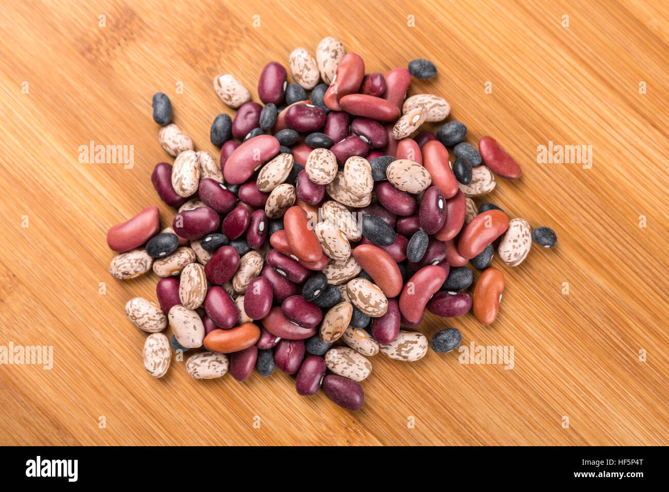 Chili bean mix isolated on a wood background Stock Photo - Alamy