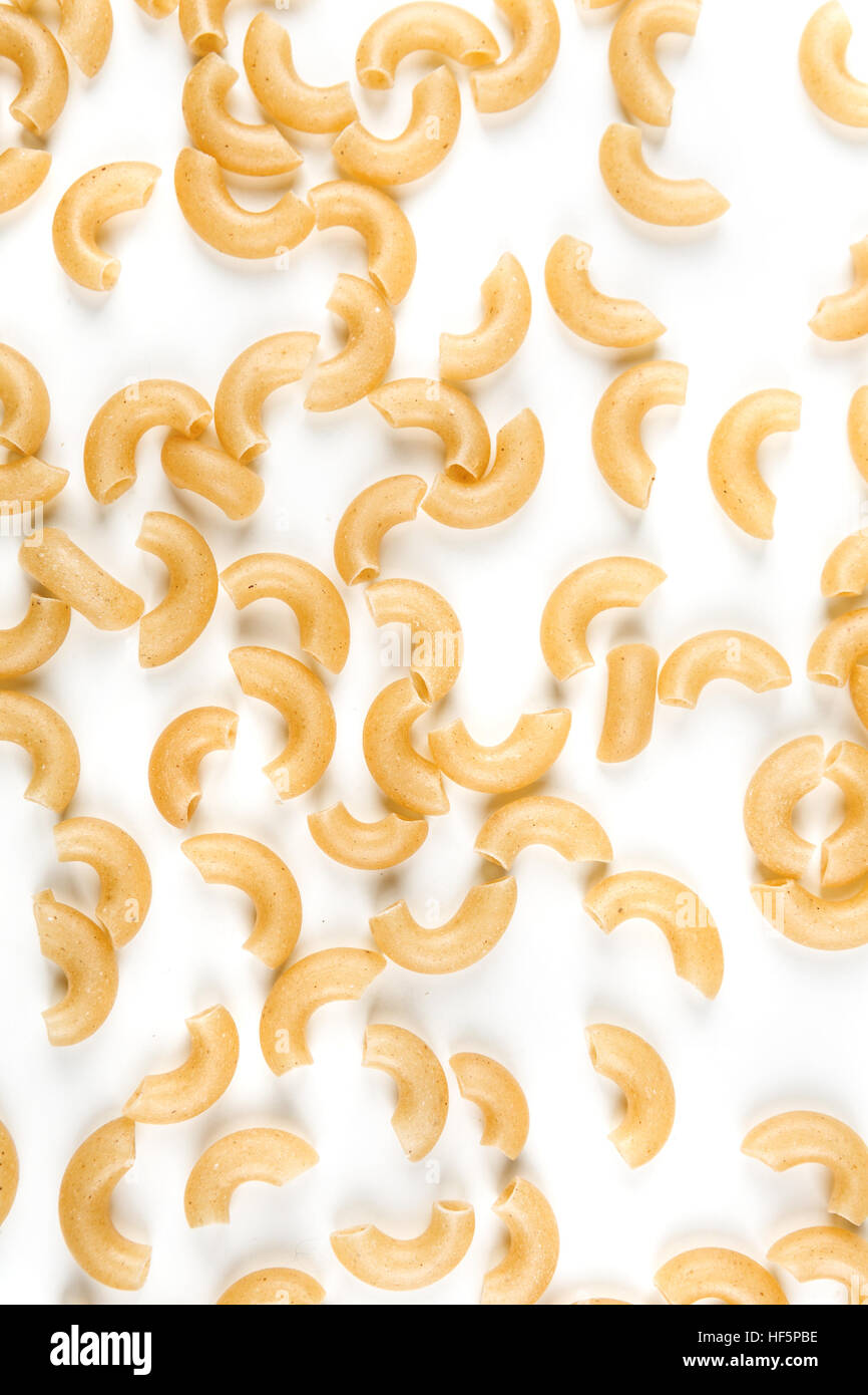 Brown rice elbow macaroni isolated on a white background Stock Photo ...