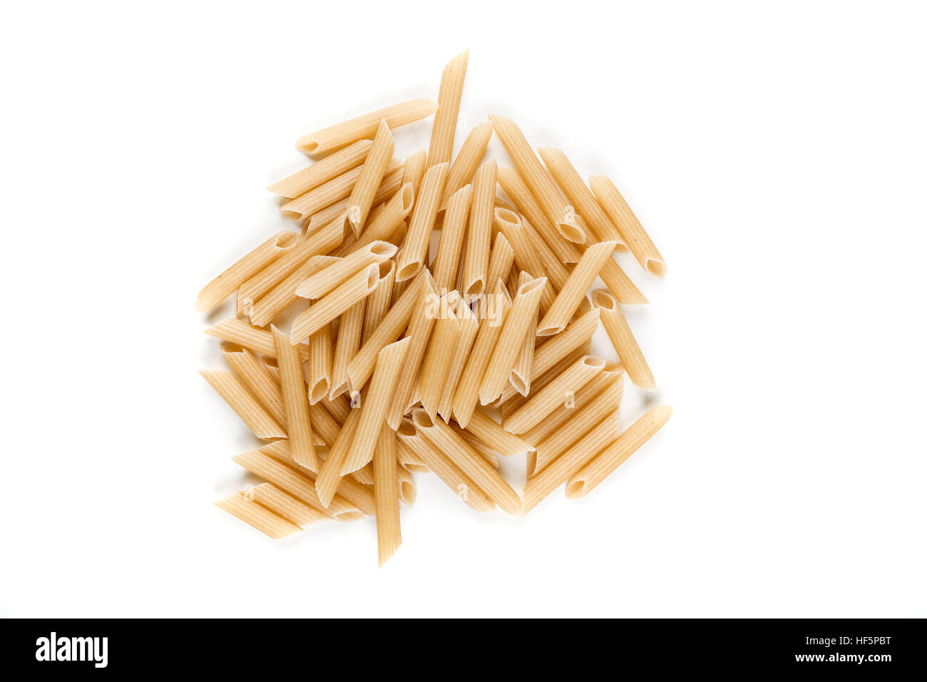 Brown rice penne isolated on a white background Stock Photo - Alamy
