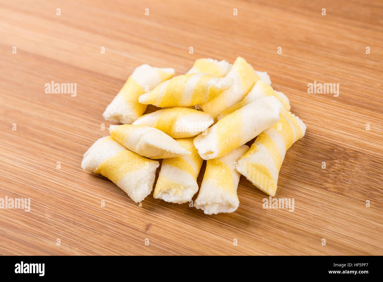 Lemon flavored wafer puffs isolated on a wood background Stock Photo ...